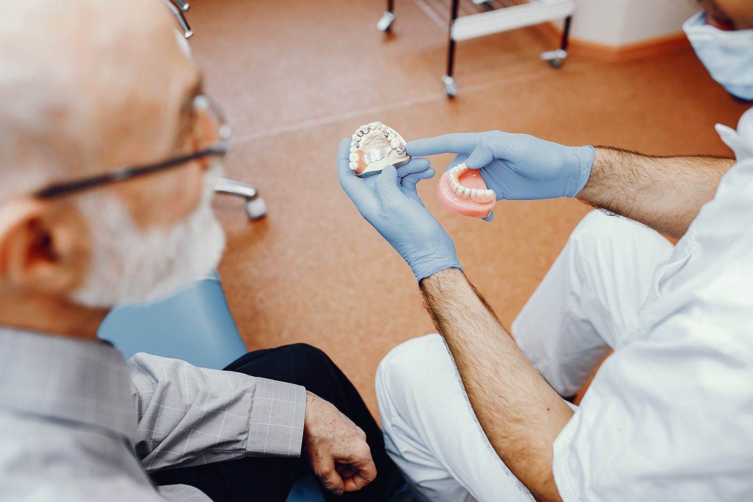Old man sitting in denture clinic | Digital Denture Centre